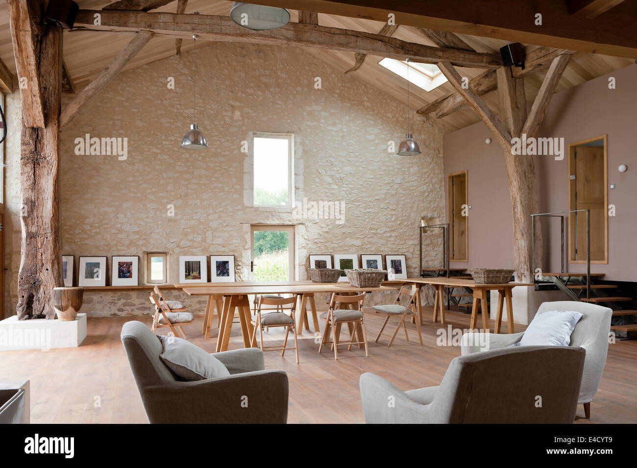 Converted open-plan barn with original timber supports, skylight and ...