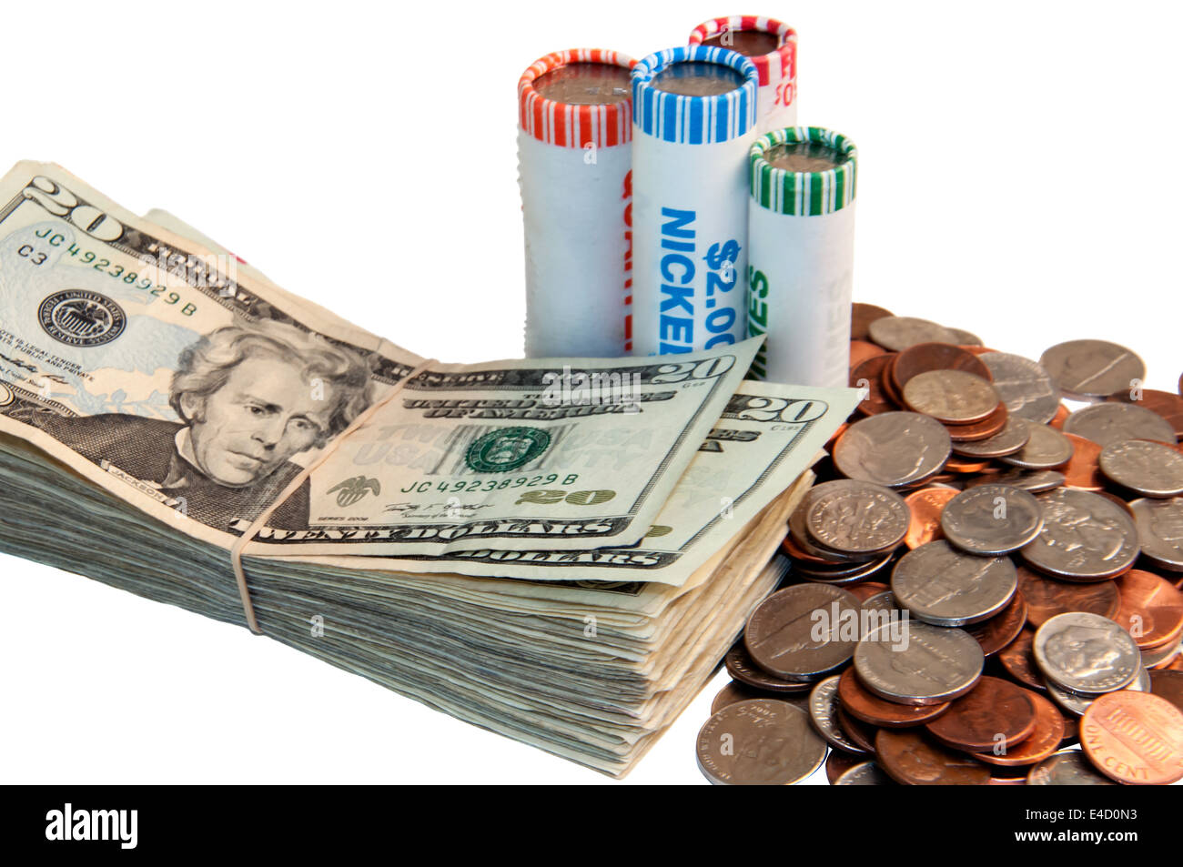 American currency with stacks of bills and rolls of coins standing next ...