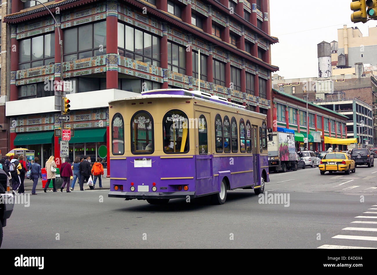 A trolley car rides downtown Chinatown street in New York City Stock ...