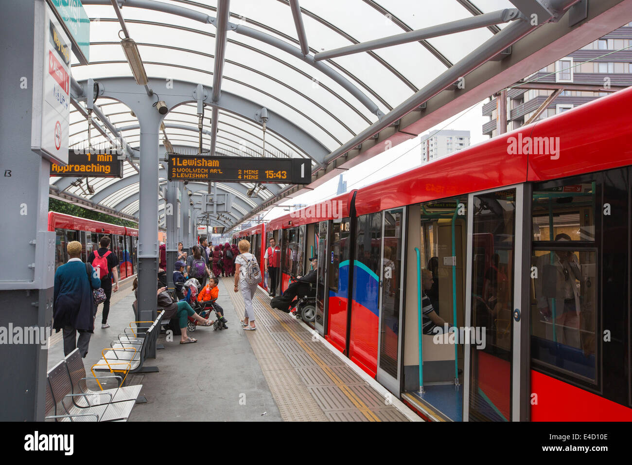 A Docklands Light Railway train (DLR) at a station near Canary wharf ...