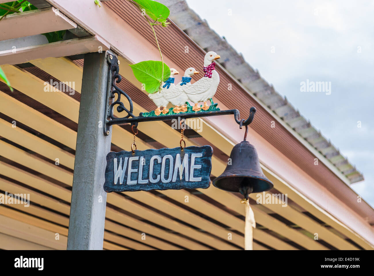 Welcome Sign with Bell and Duck Figures Stock Photo - Alamy