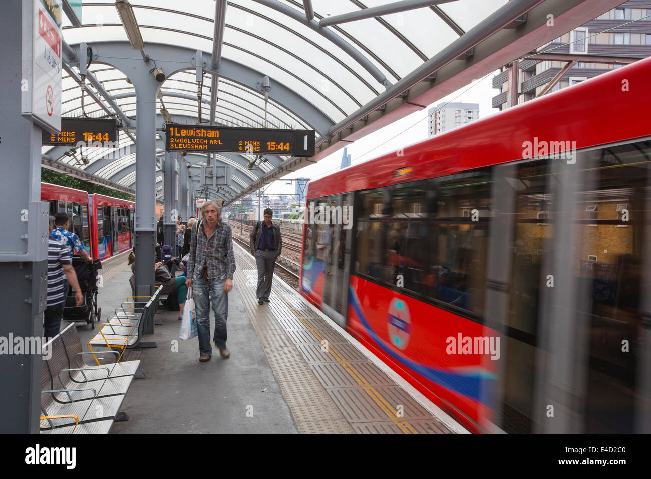 A Docklands Light Railway train (DLR) at a station near Canary wharf ...