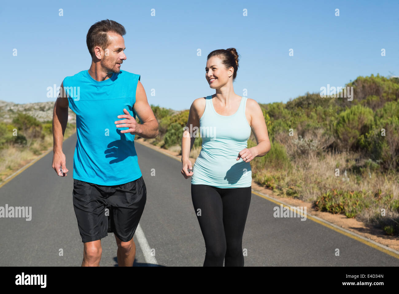 Happy man woman jogging hi-res stock photography and images - Alamy