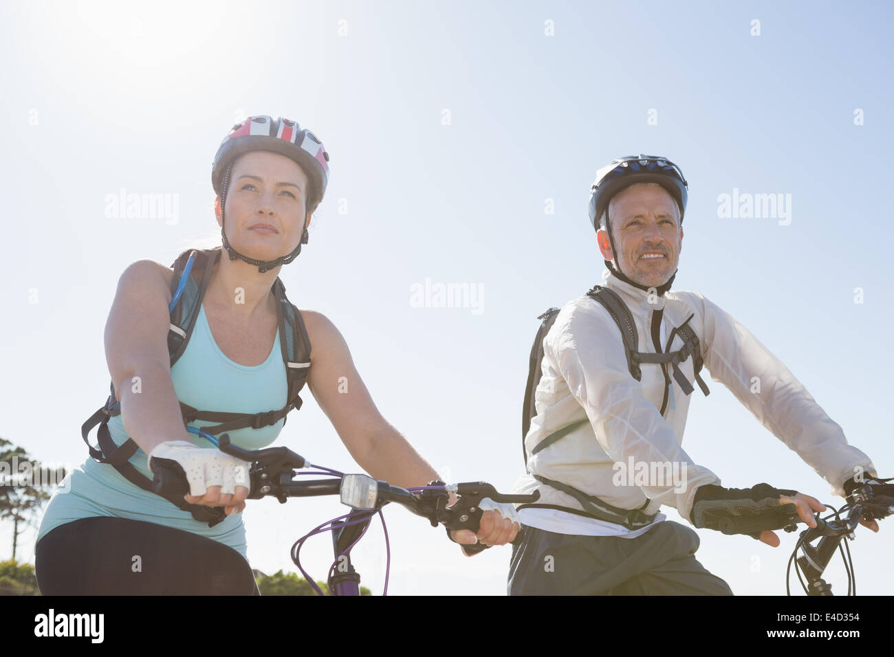 Active couple going for a bike ride in the countryside Stock Photo - Alamy