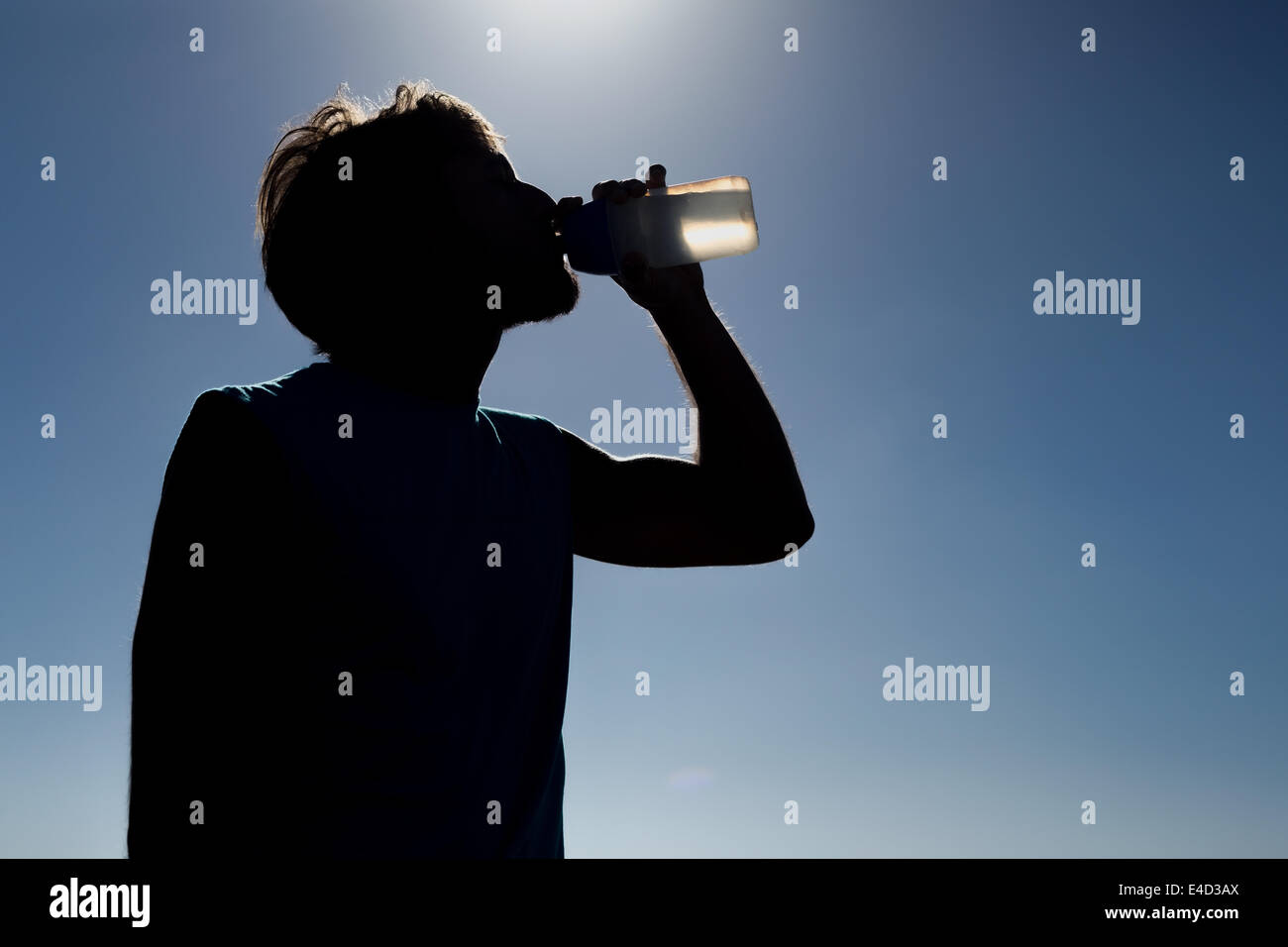 Man drinking from bottle blue hi-res stock photography and images - Alamy