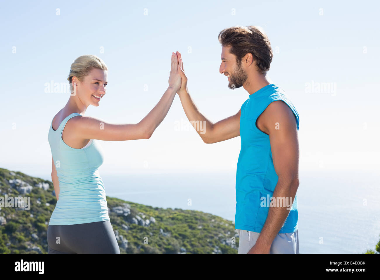 Young couple celebrating high five hi-res stock photography and images ...