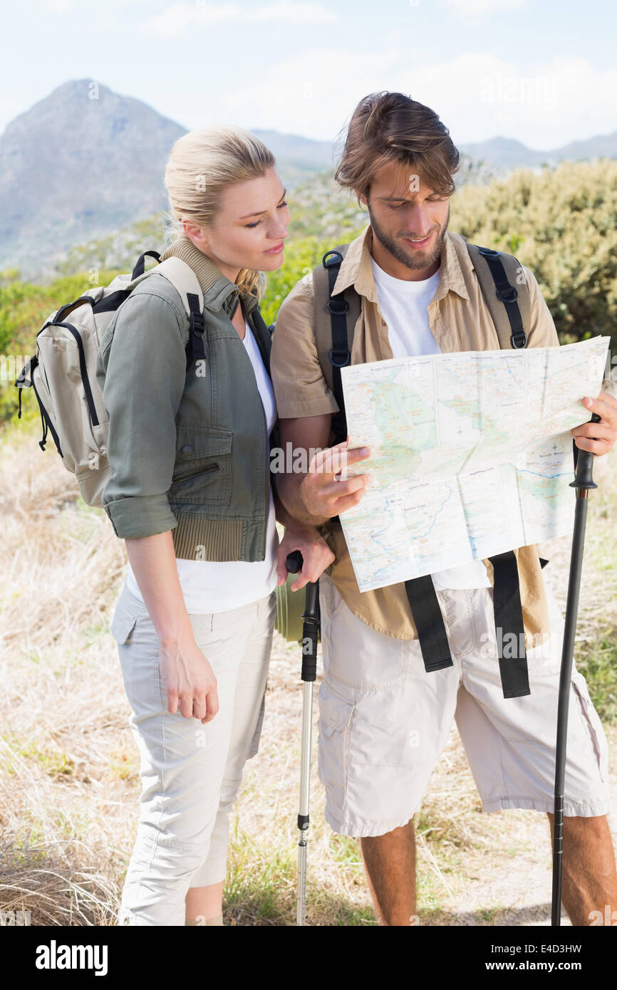 Woman on mountain reading map hi-res stock photography and images - Alamy