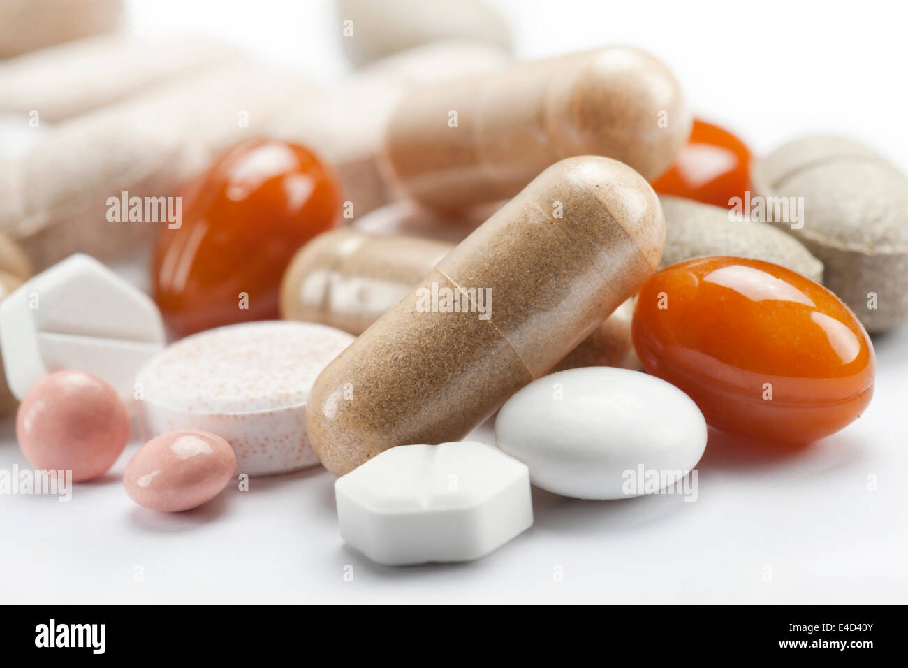 variety of colorfull pills and tablets, close up on white background ...