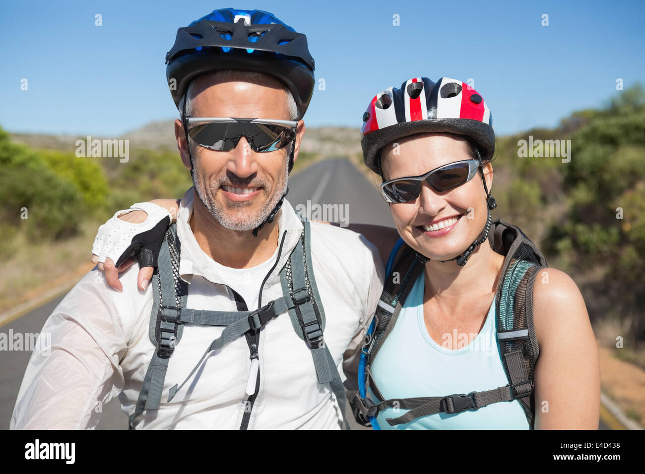 Active couple going for a bike ride in the countryside Stock Photo - Alamy