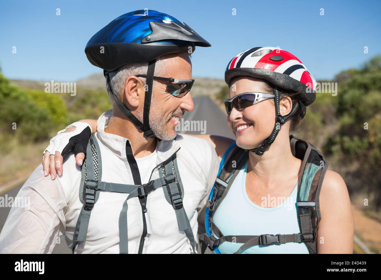 Active couple going for a bike ride in the countryside Stock Photo - Alamy