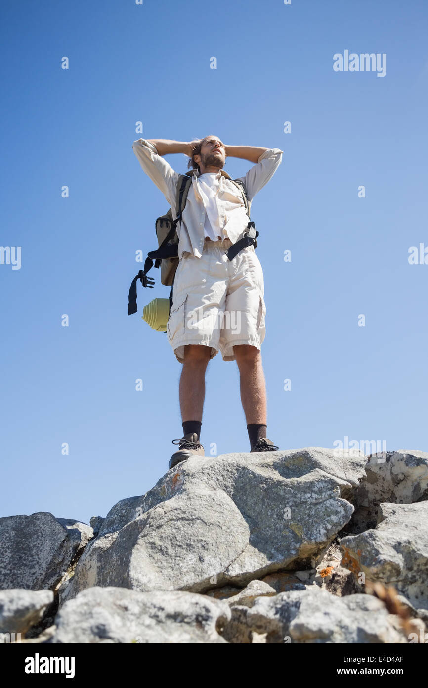 Handsome hiker standing at the summit Stock Photo - Alamy