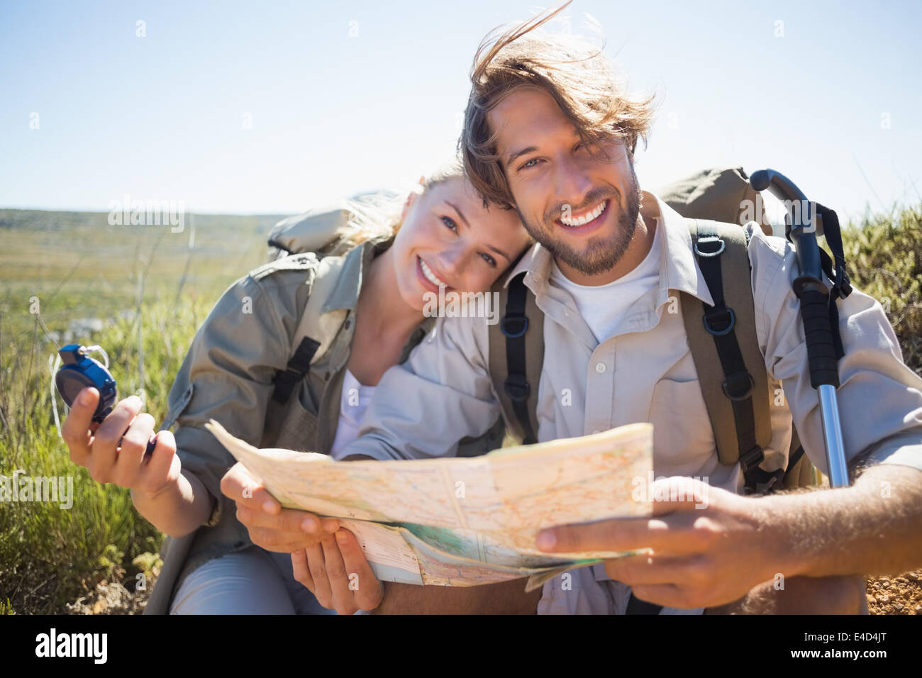 Man using compass on map hi-res stock photography and images - Alamy