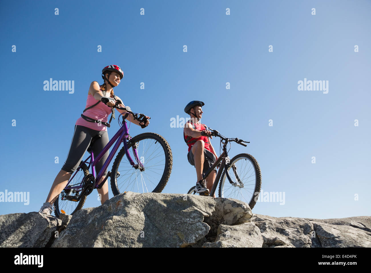 Active couple on a bike ride in the countryside Stock Photo - Alamy