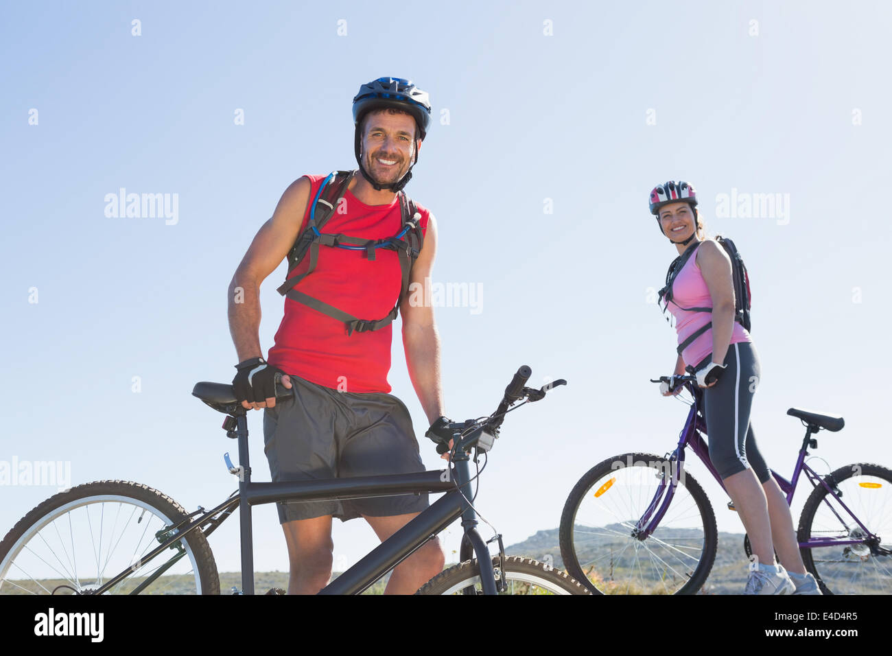 Female cyclist standing mountain hi-res stock photography and images ...