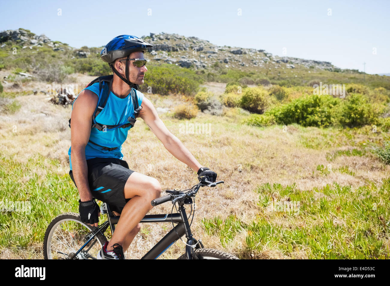 Fit cyclist riding in the countryside Stock Photo - Alamy
