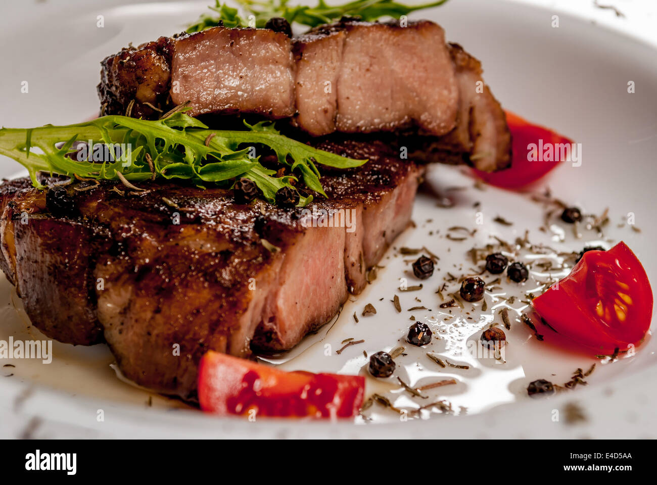 Pork neck steak with vegetables and pepper Stock Photo - Alamy