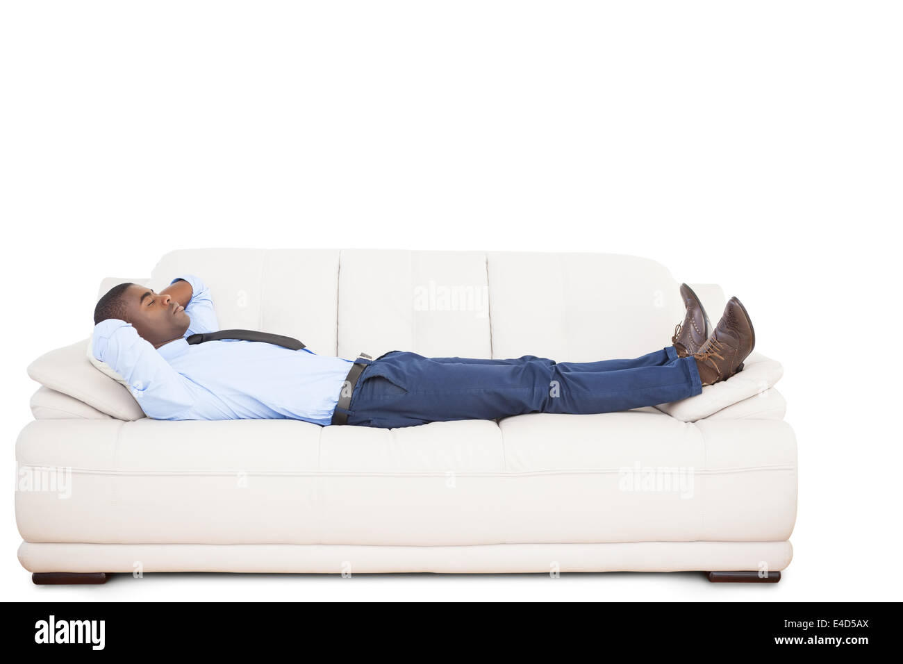 Businessman lying asleep on couch Stock Photo - Alamy