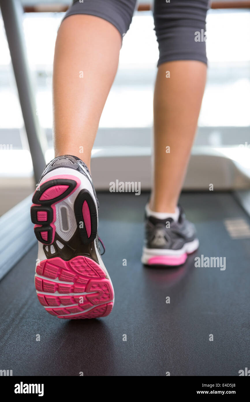 Womans feet running on the treadmill Stock Photo - Alamy