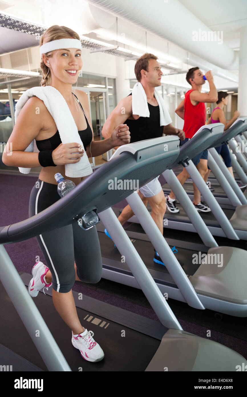 Row of people working out on treadmills Stock Photo - Alamy
