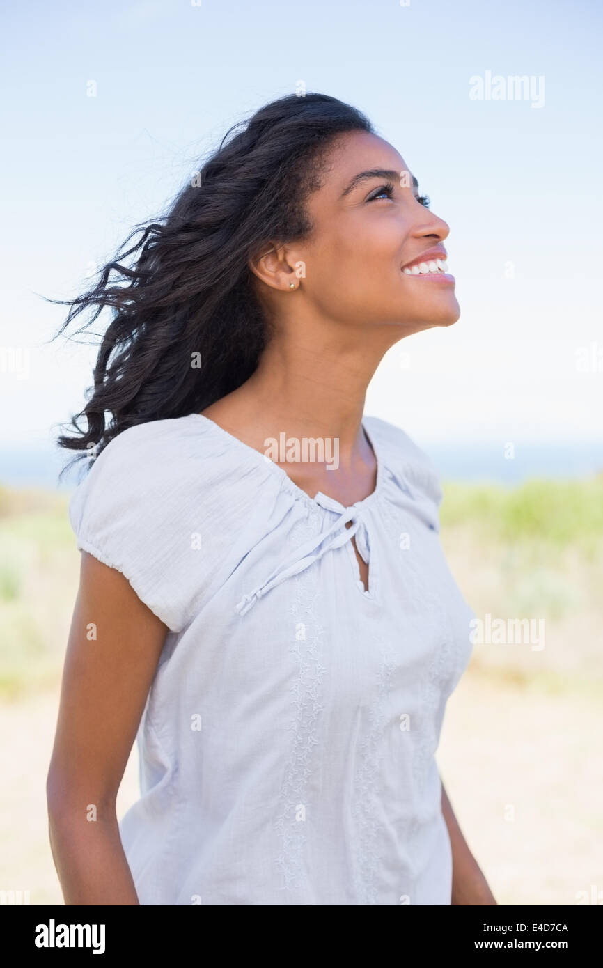 Casual woman smiling in the wind Stock Photo - Alamy