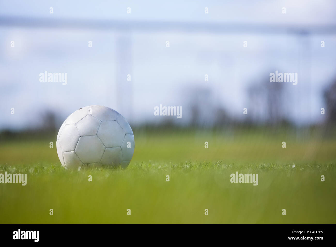 Football on an empty pitch Stock Photo - Alamy