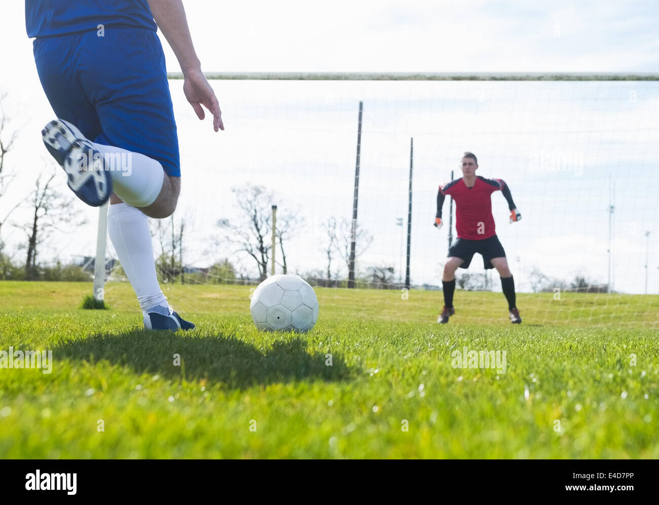 Goalkeeper in red ready to save a penalty Stock Photo - Alamy