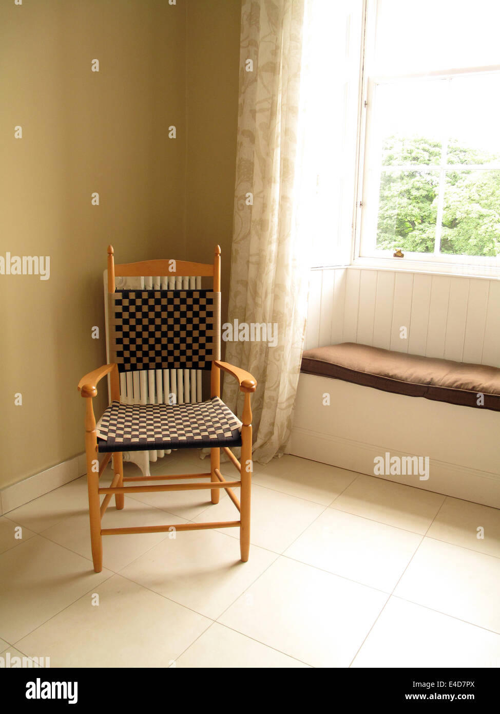 Design feature of wooden chair by window Stock Photo - Alamy