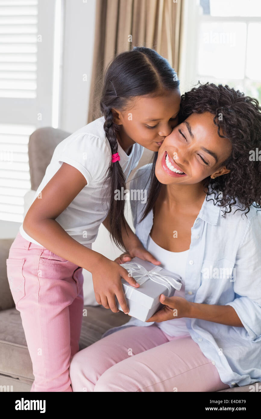 Pretty Mother Sitting On Couch Offering Daughter A Gift Stock Photo Alamy pretty-mother-sitting-on-couch-offering-daughter-a-gift-stock-photo-alamy