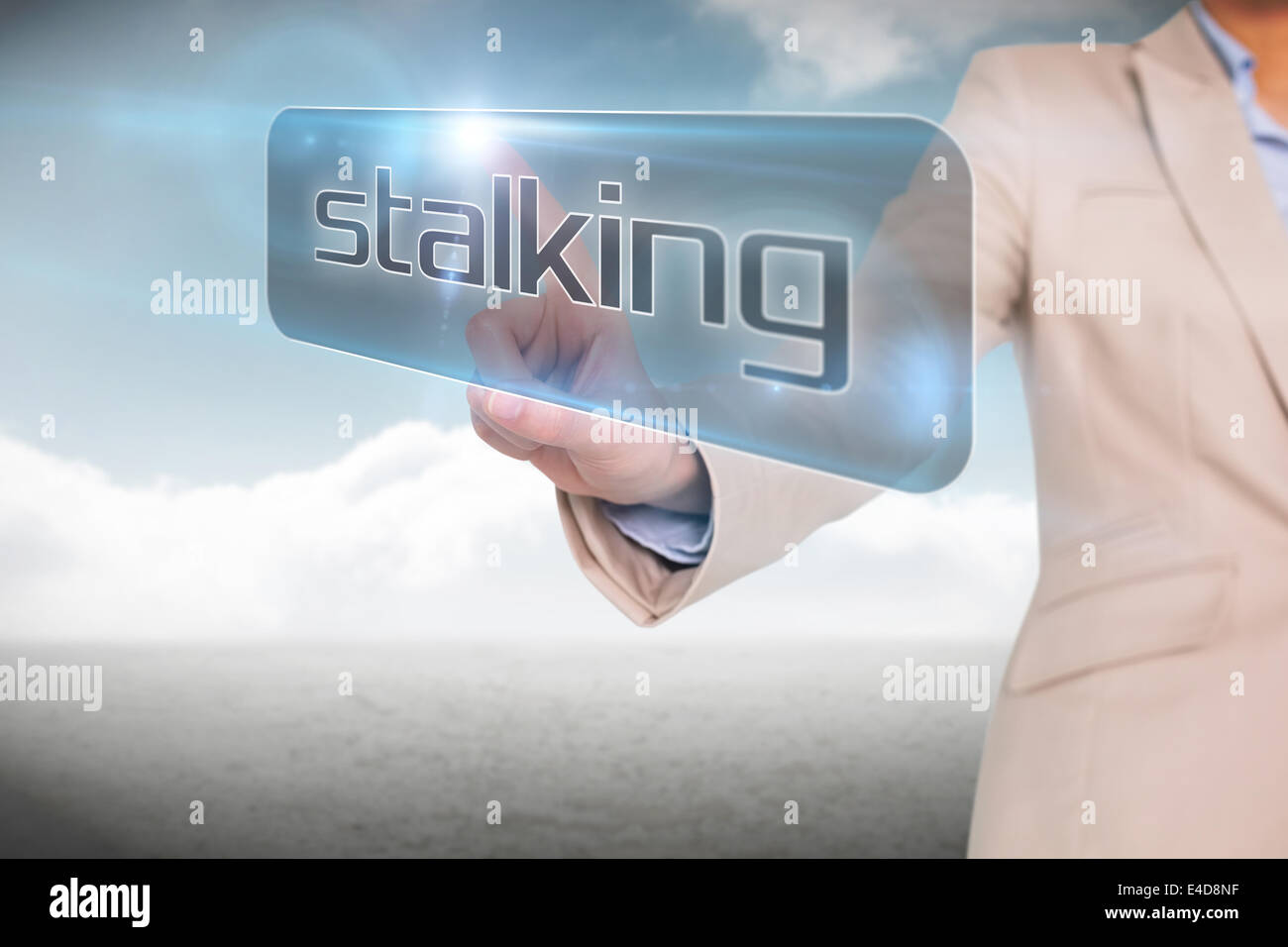 Businesswoman pointing to word stalking Stock Photo - Alamy