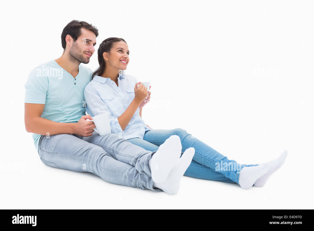 Cute couple sitting having coffee Stock Photo - Alamy