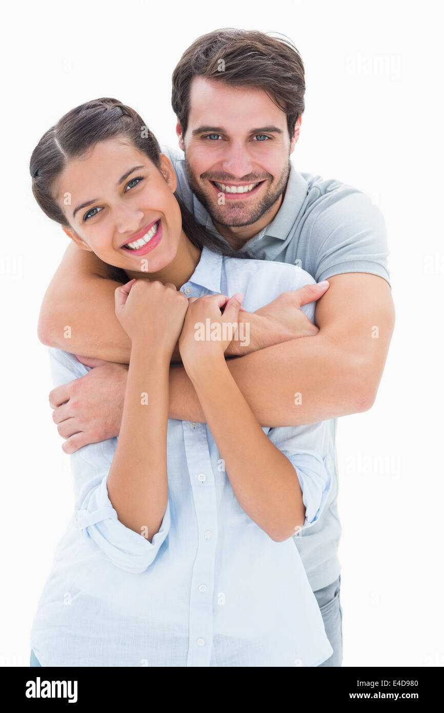 Cute couple smiling at camera Stock Photo - Alamy