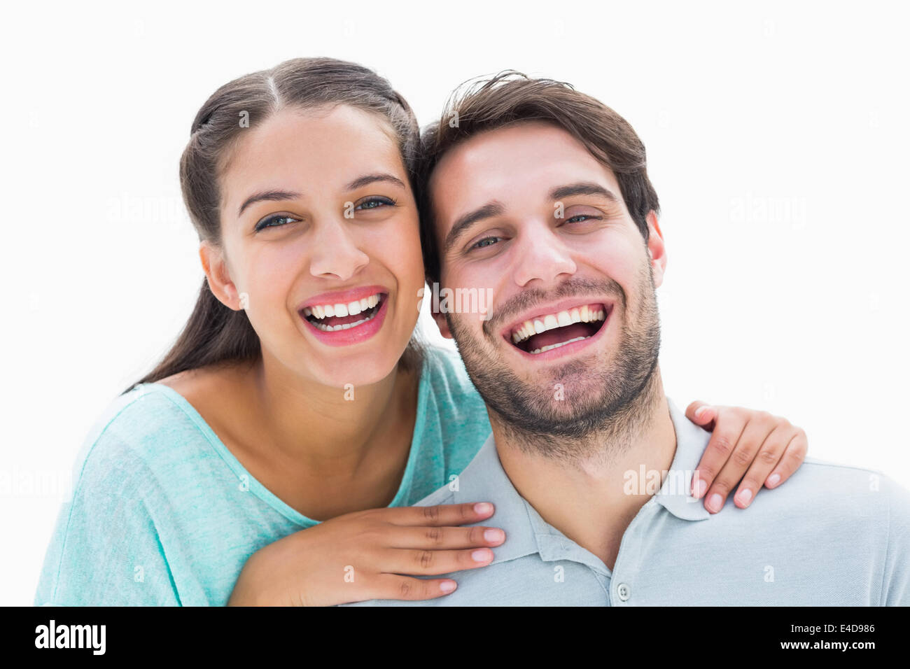 Cute couple smiling at camera Stock Photo - Alamy