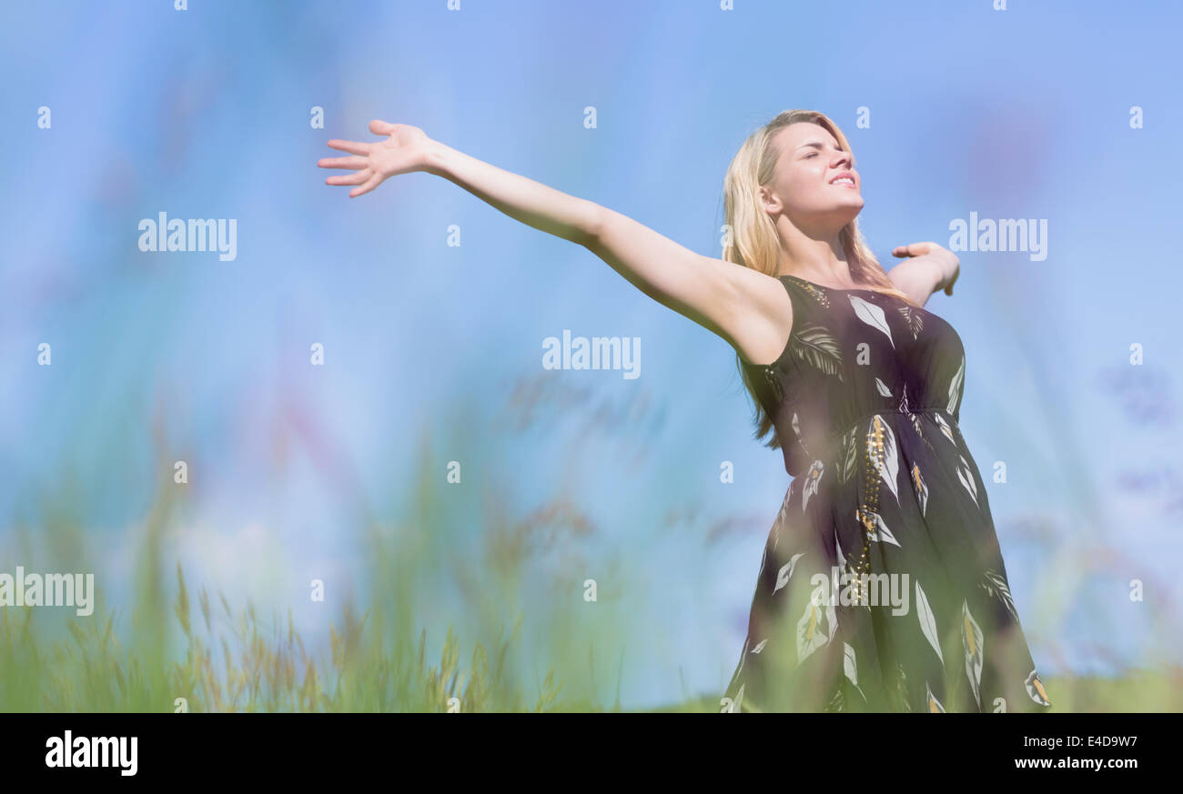 Pretty blonde in sundress standing hi-res stock photography and images ...