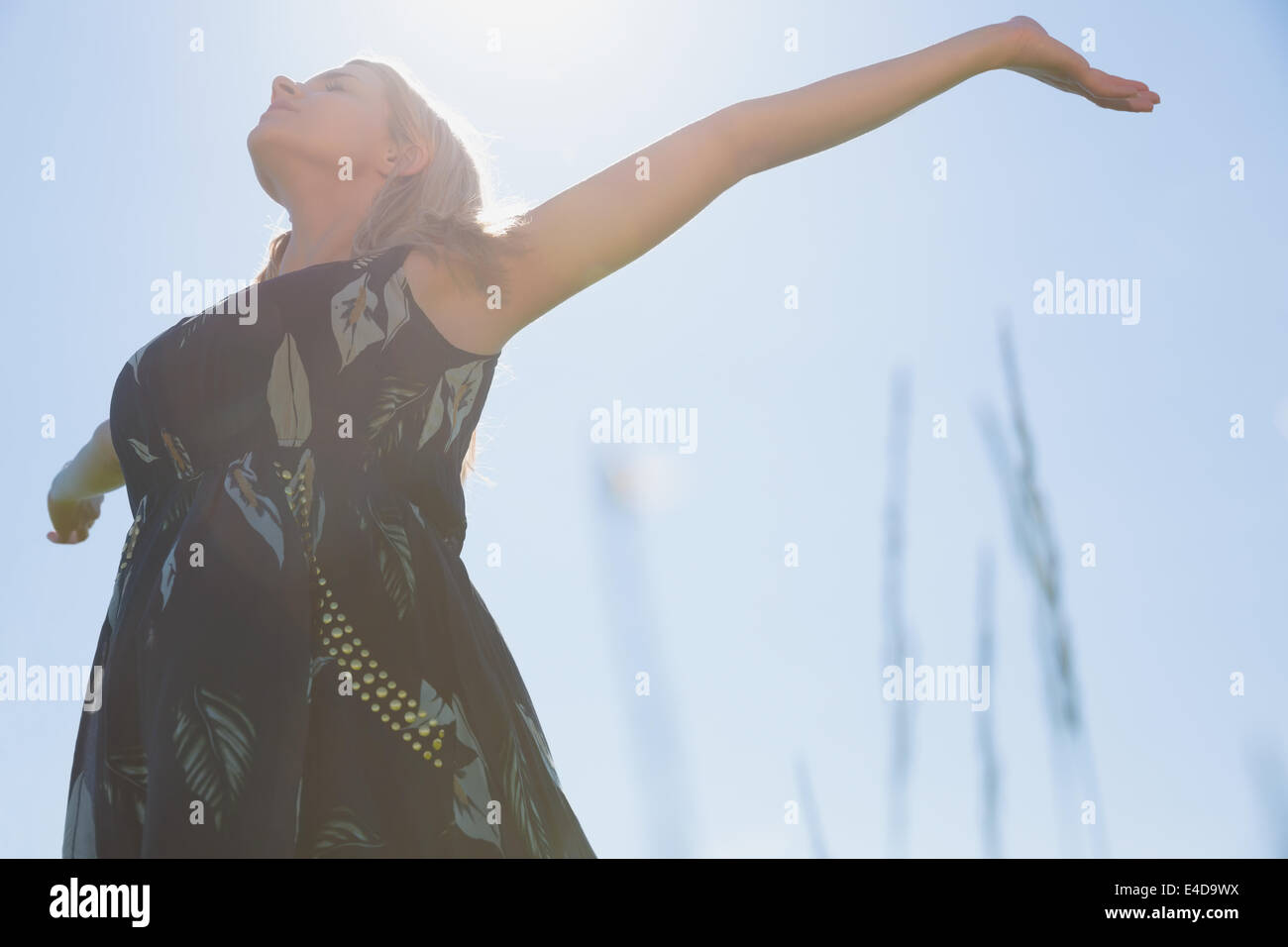 Pretty blonde in sundress standing hi-res stock photography and images ...