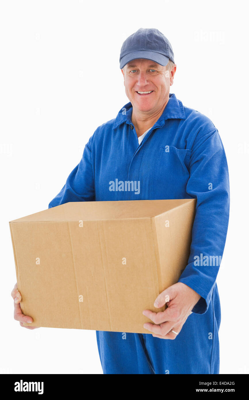 Happy delivery man holding cardboard box Stock Photo - Alamy