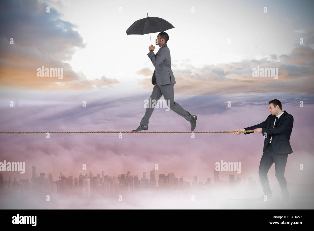 Man walking tightrope hi-res stock photography and images - Alamy