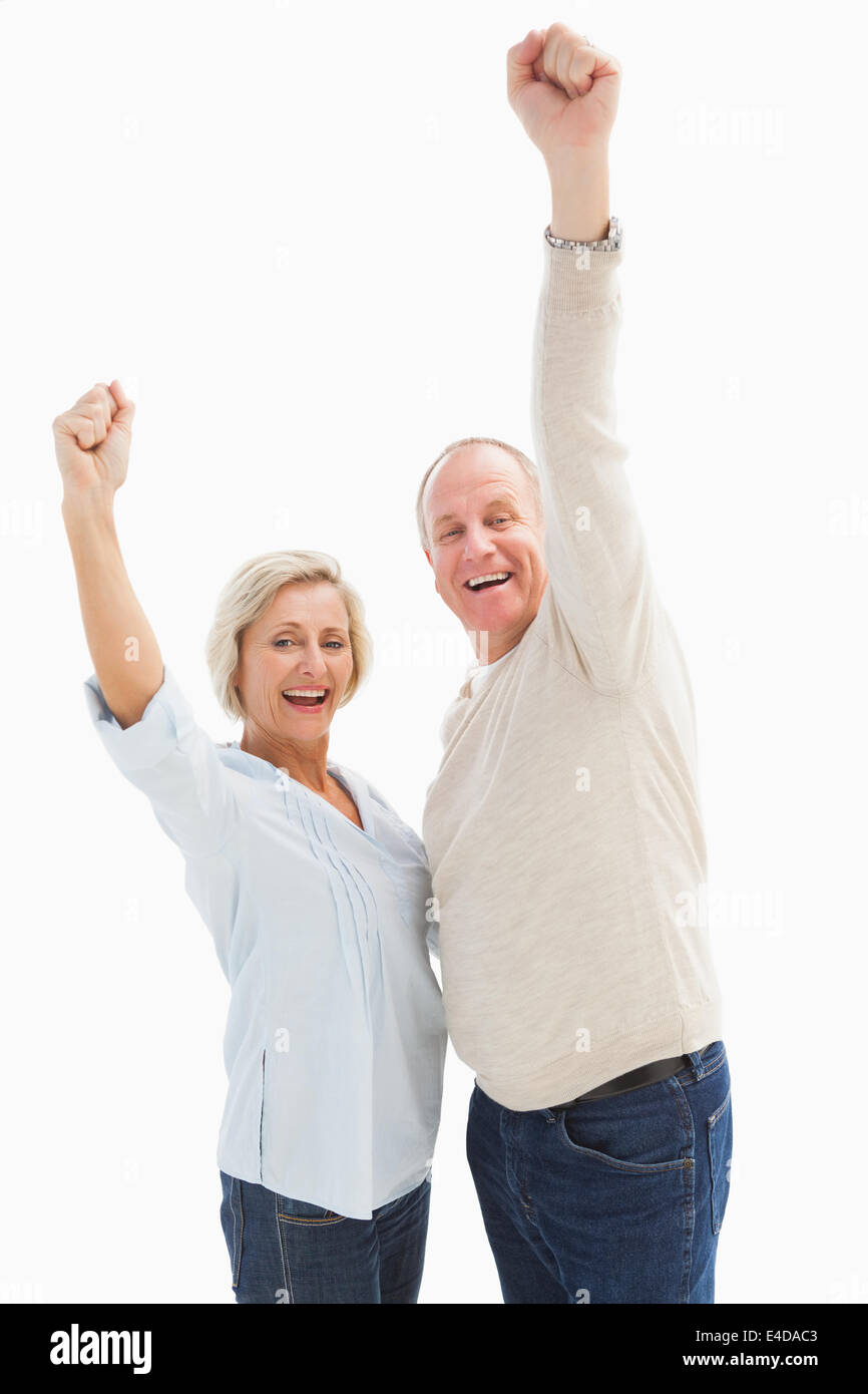 Happy mature couple cheering at camera Stock Photo - Alamy