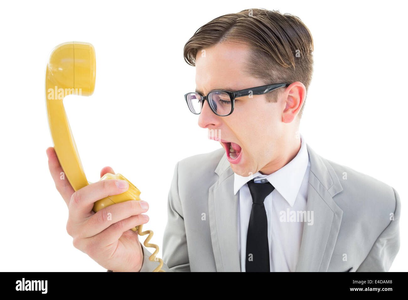 Geeky businessman shouting at retro phone Stock Photo - Alamy
