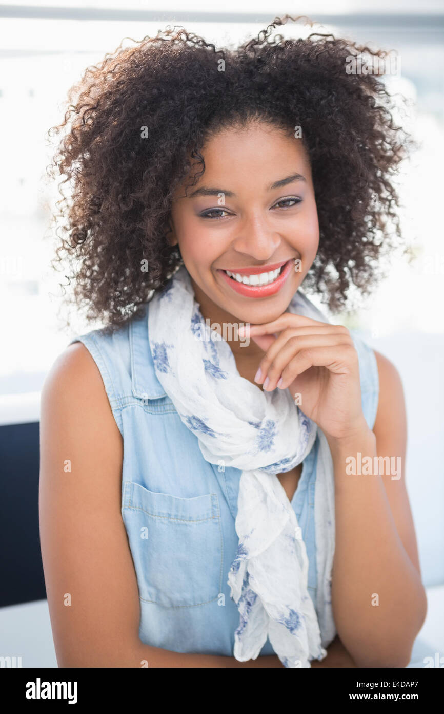 Pretty designer smiling at camera Stock Photo - Alamy