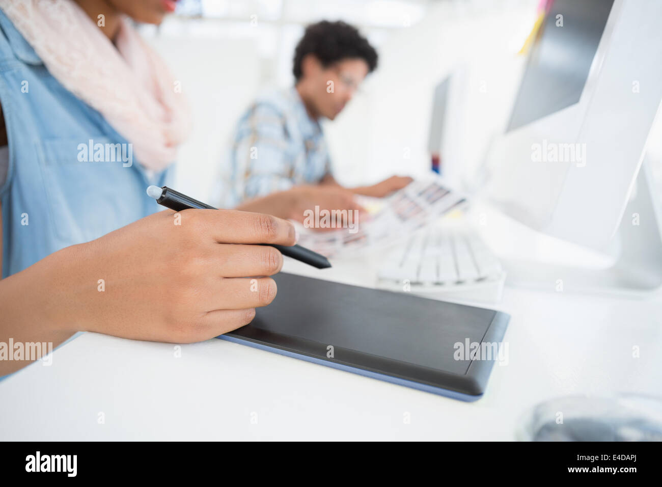 Focused young design team working at desk Stock Photo - Alamy