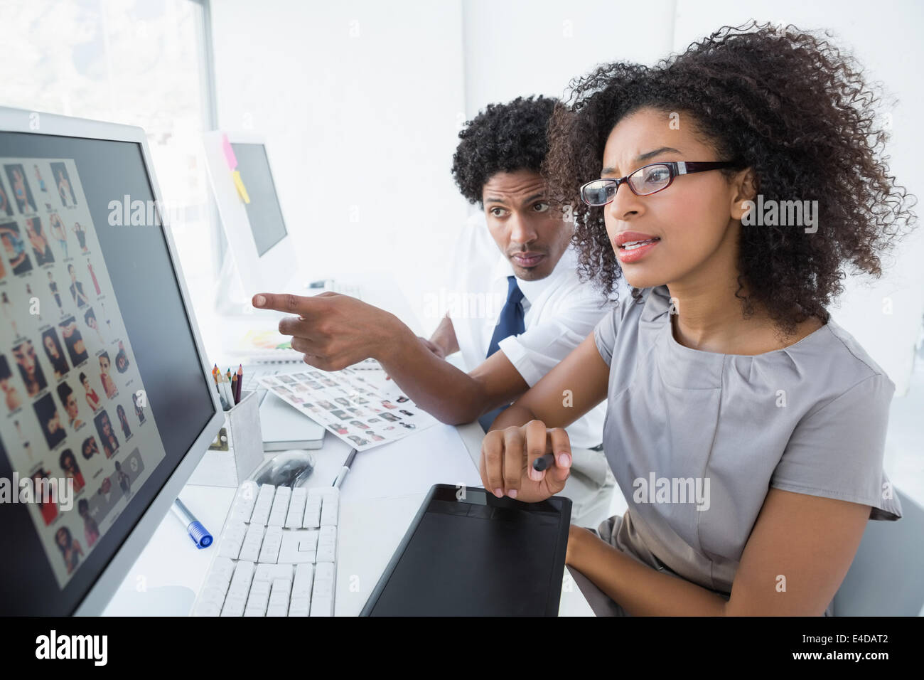 Young editorial team working together Stock Photo - Alamy