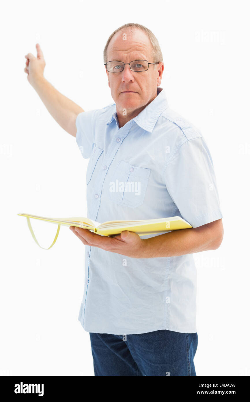 Serious preacher man pointing and holding gospel Stock Photo - Alamy