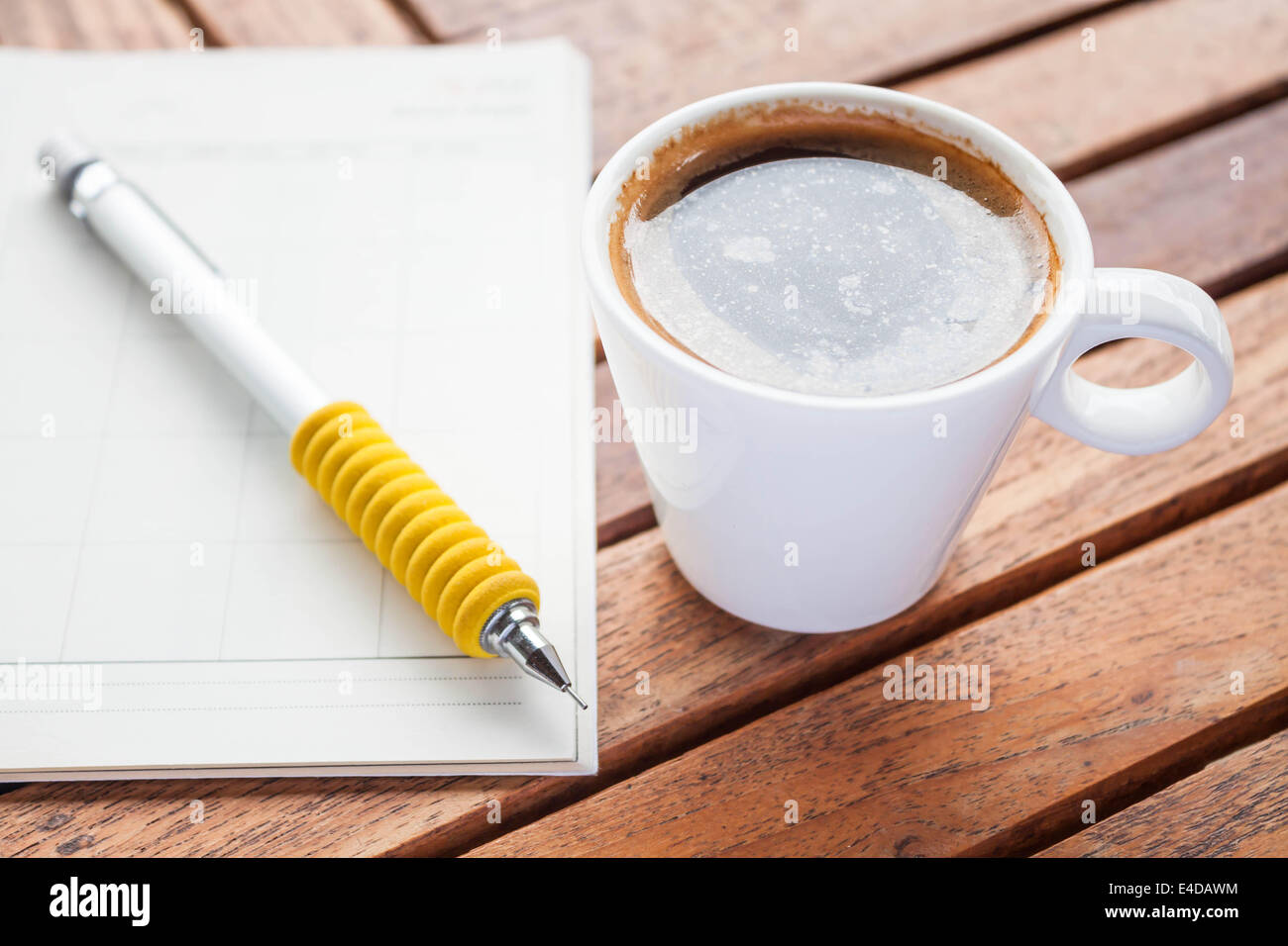 Coffee break with hot espresso on work wood table Stock Photo - Alamy