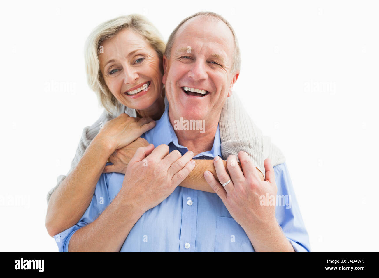 Happy mature couple embracing smiling at camera Stock Photo - Alamy