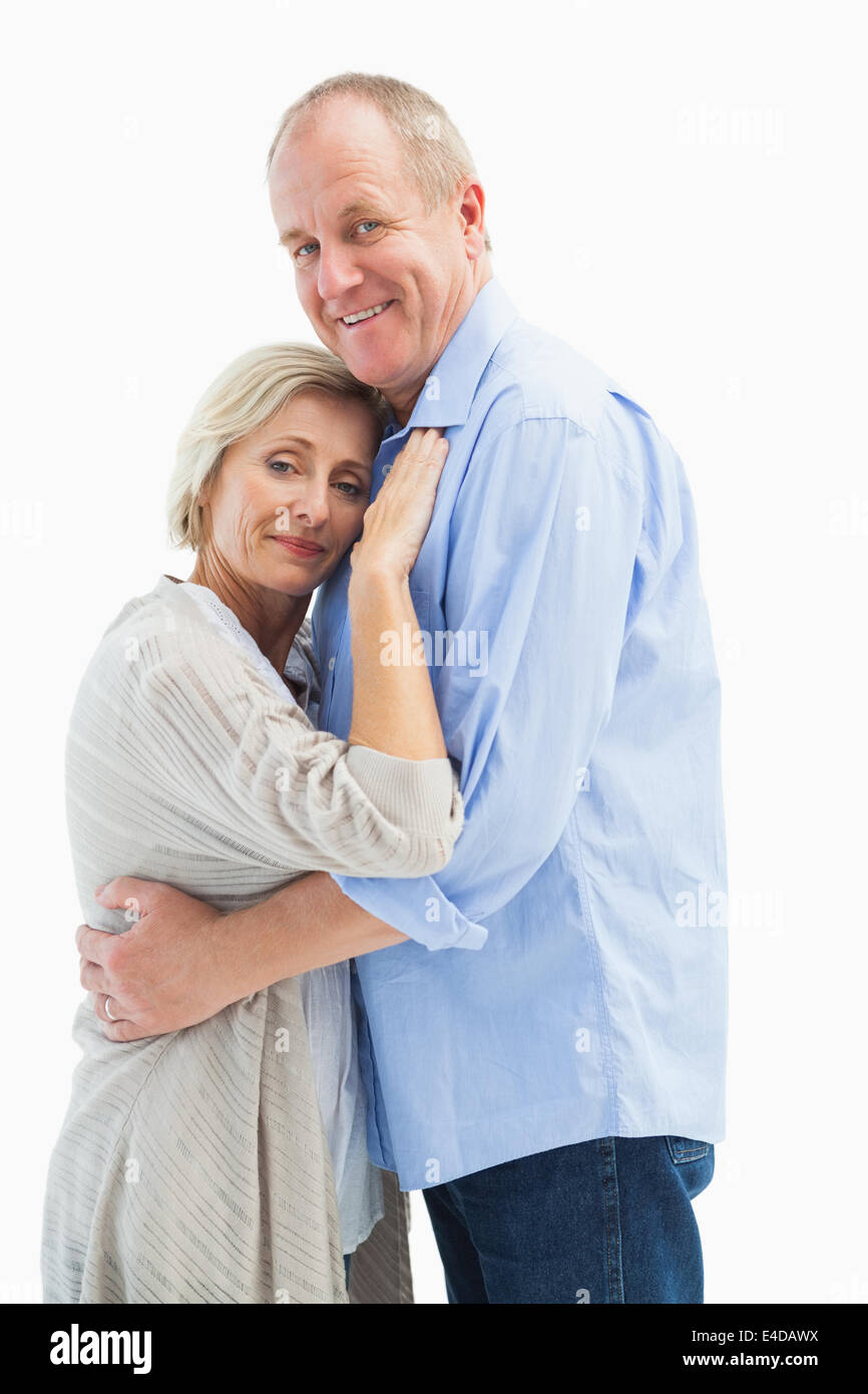 Happy mature couple hugging and smiling Stock Photo - Alamy