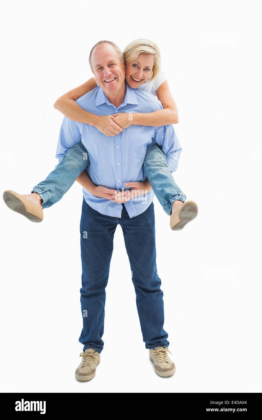 Mature man carrying his partner on his back Stock Photo - Alamy