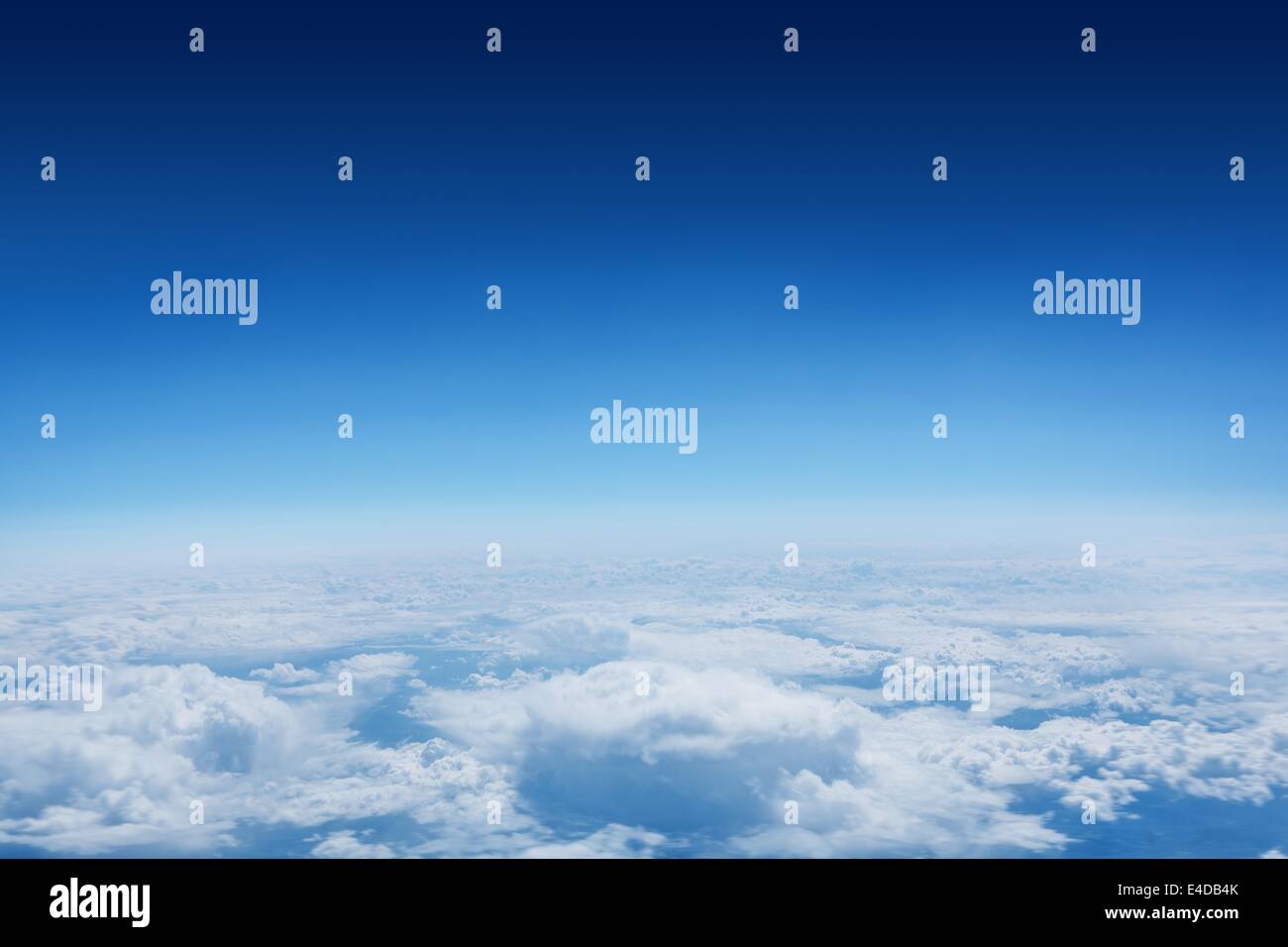Blue sky over clouds at high altitude Stock Photo - Alamy