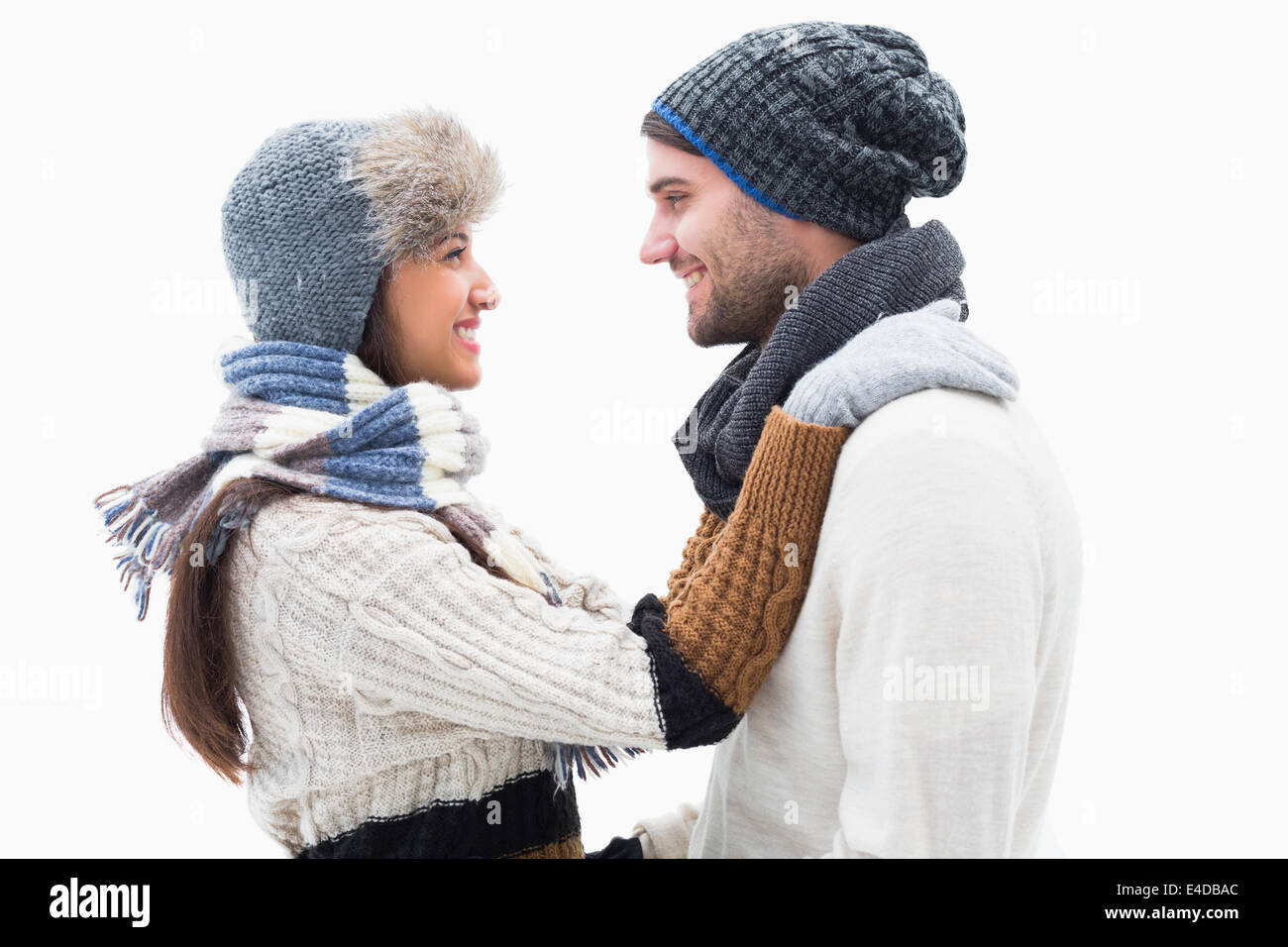 Attractive young couple in warm clothes hugging Stock Photo - Alamy