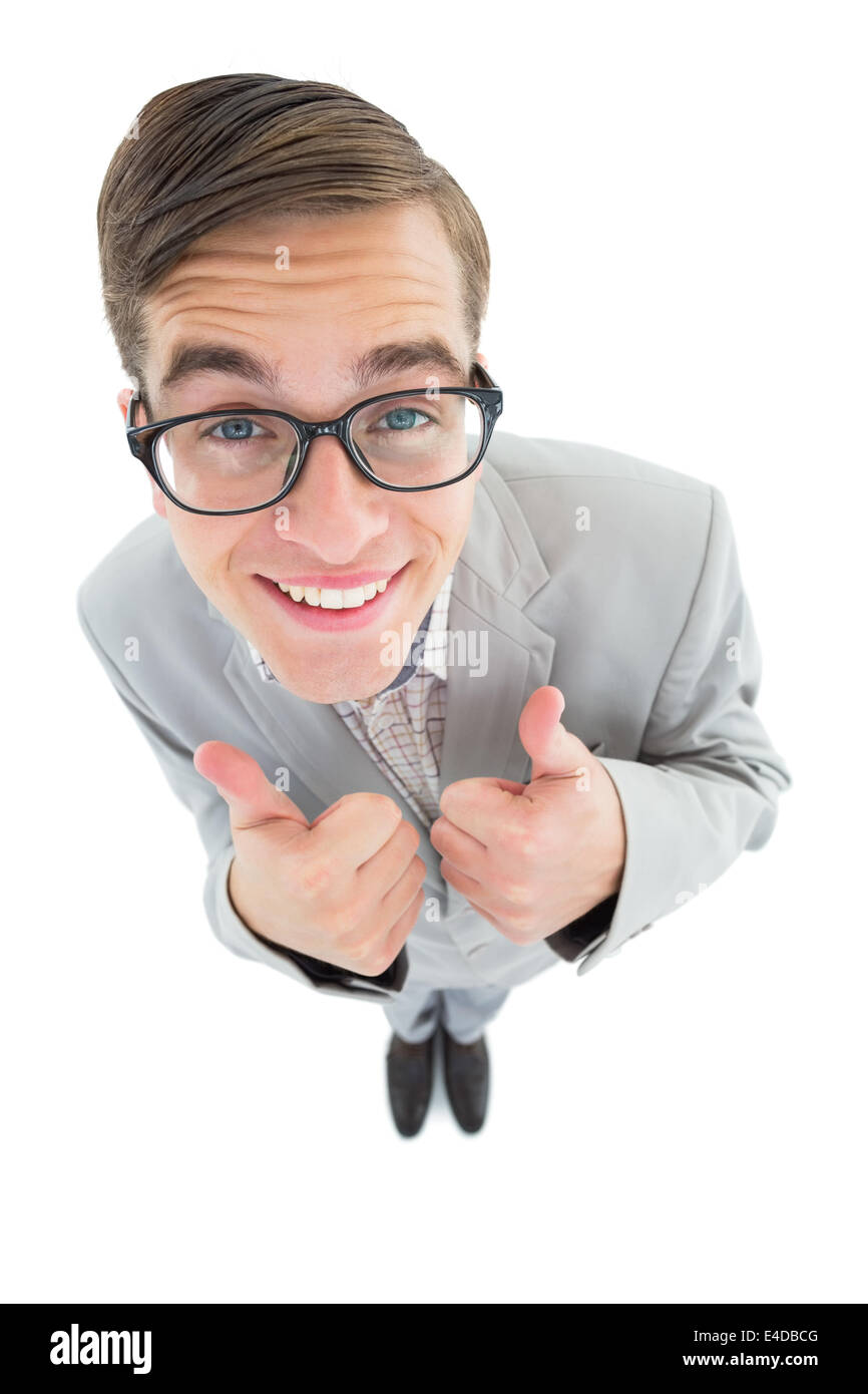 Geeky hipster smiling at camera with thumbs up Stock Photo - Alamy
