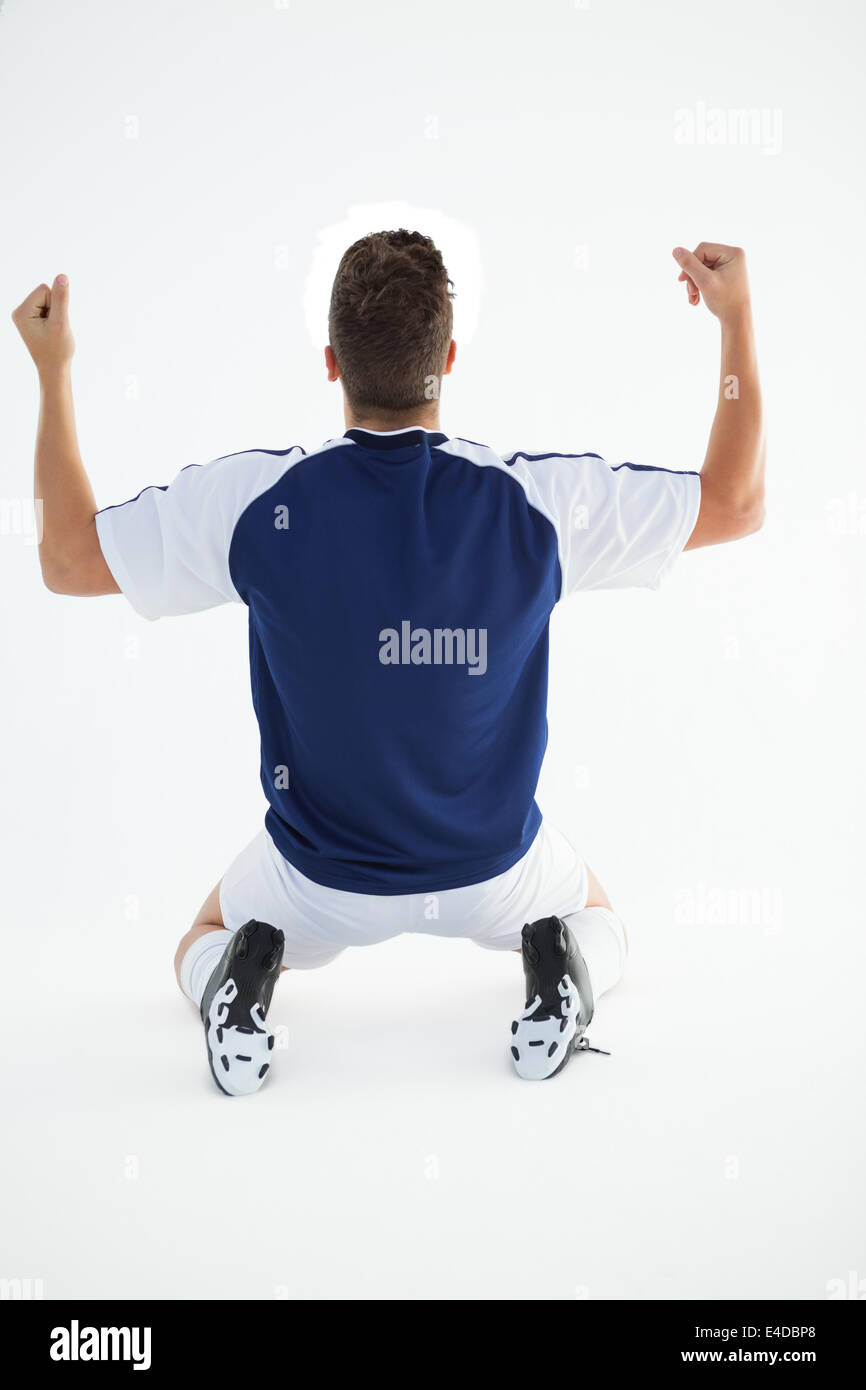 Football player in blue celebrating Stock Photo - Alamy